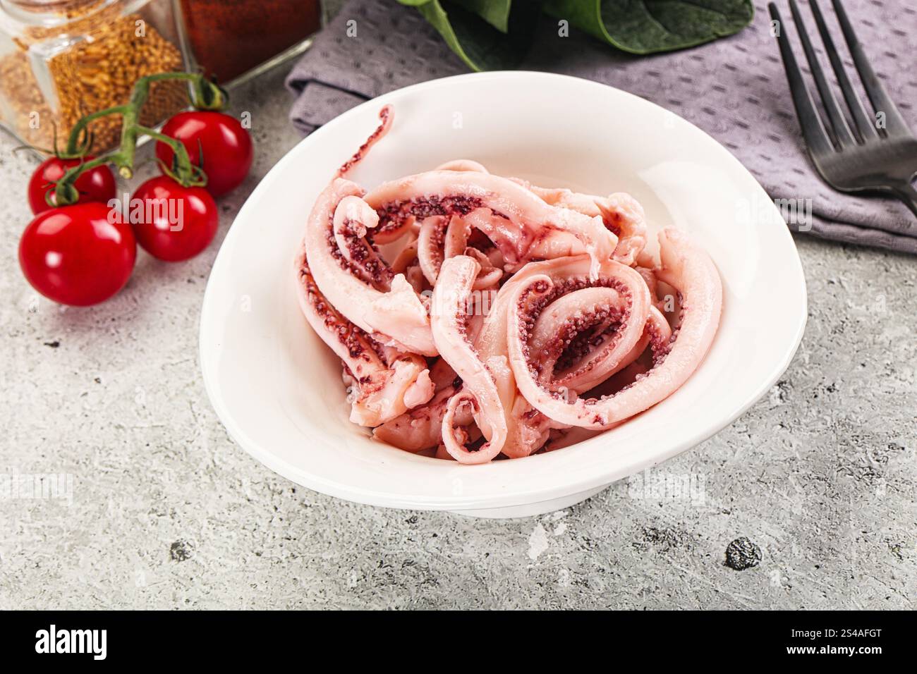 Marinated squid tentacles in the bowl for snack or salad Stock Photo ...