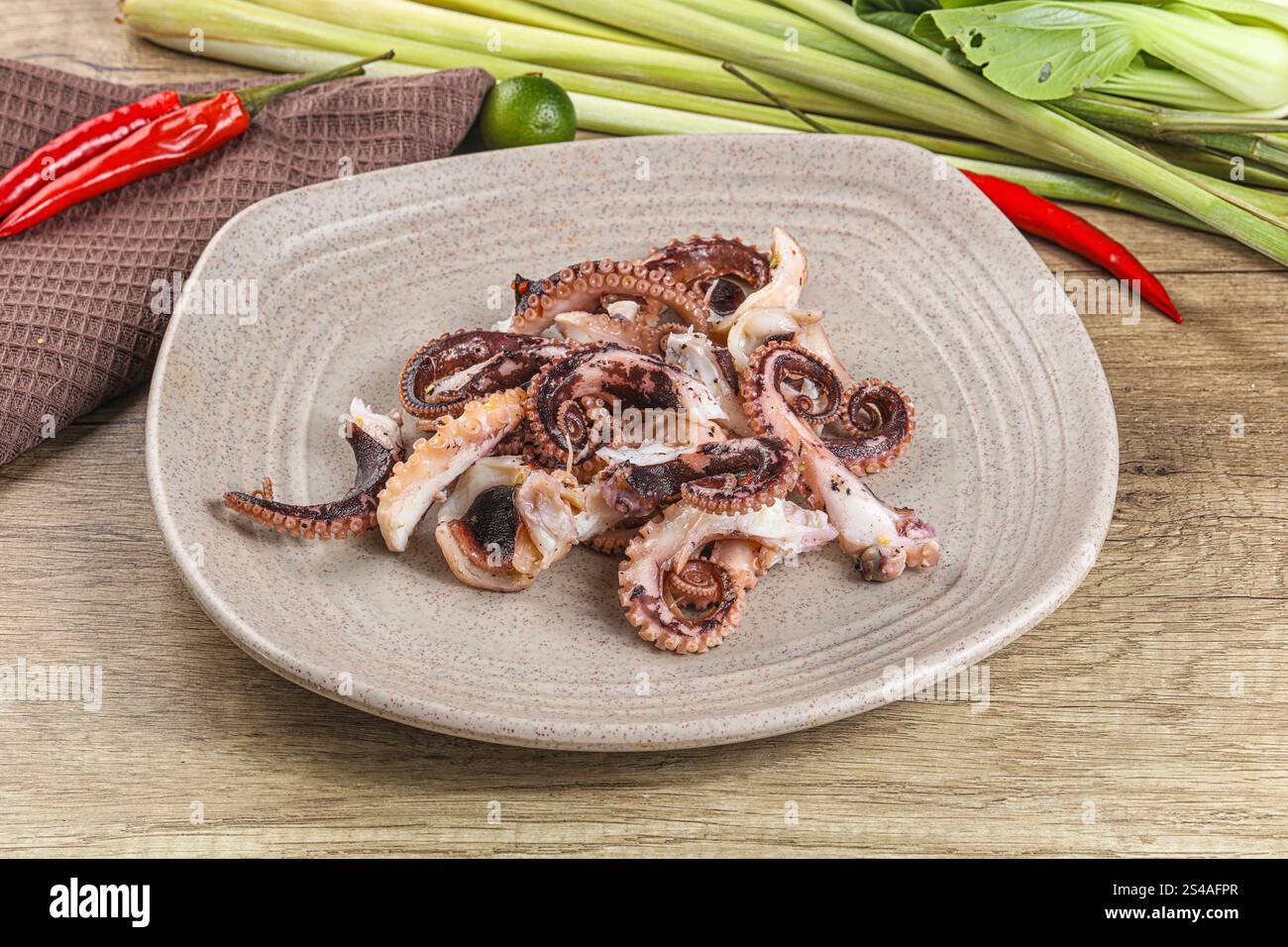 Grilled octopus red tentacle sliced appetizer Stock Photo - Alamy