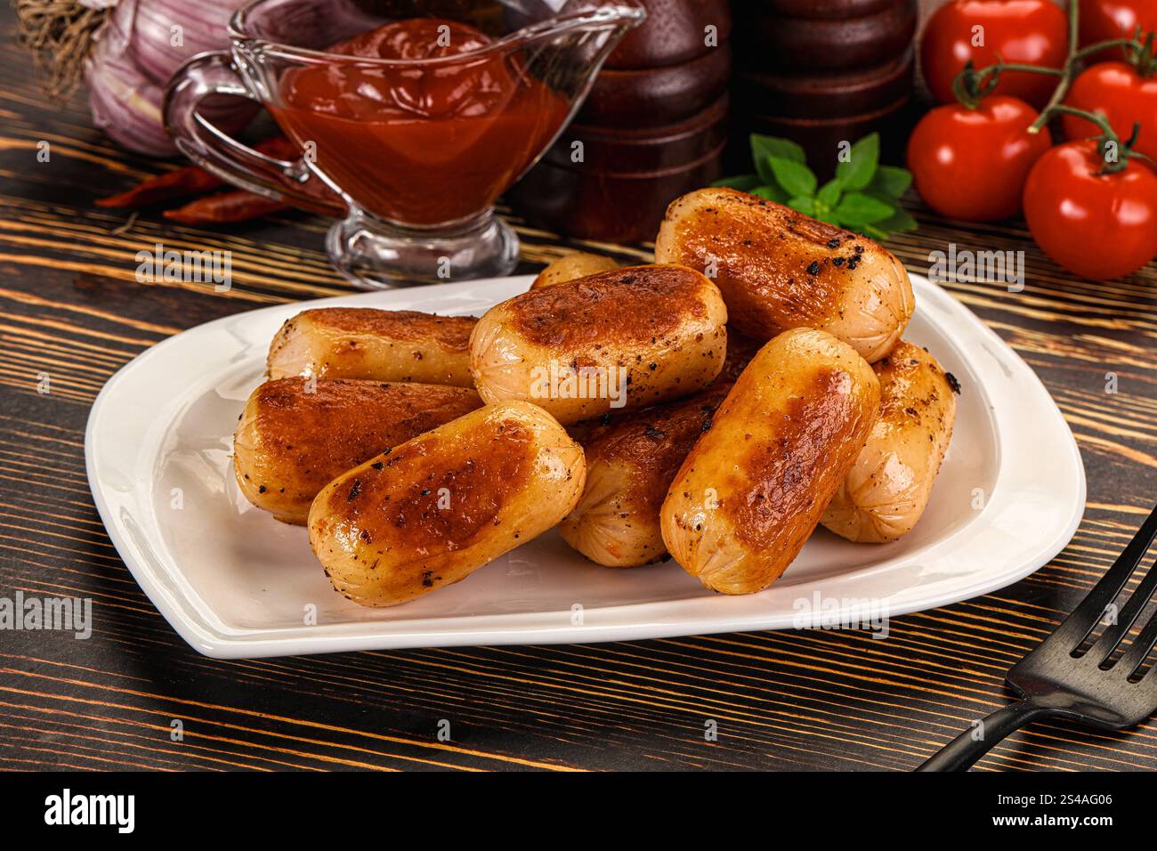 Roasted chicken mini sausages for breakfast in the bowl Stock Photo - Alamy