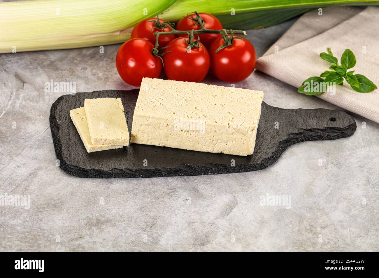Soya vegan tofu cheese brick over board Stock Photo - Alamy