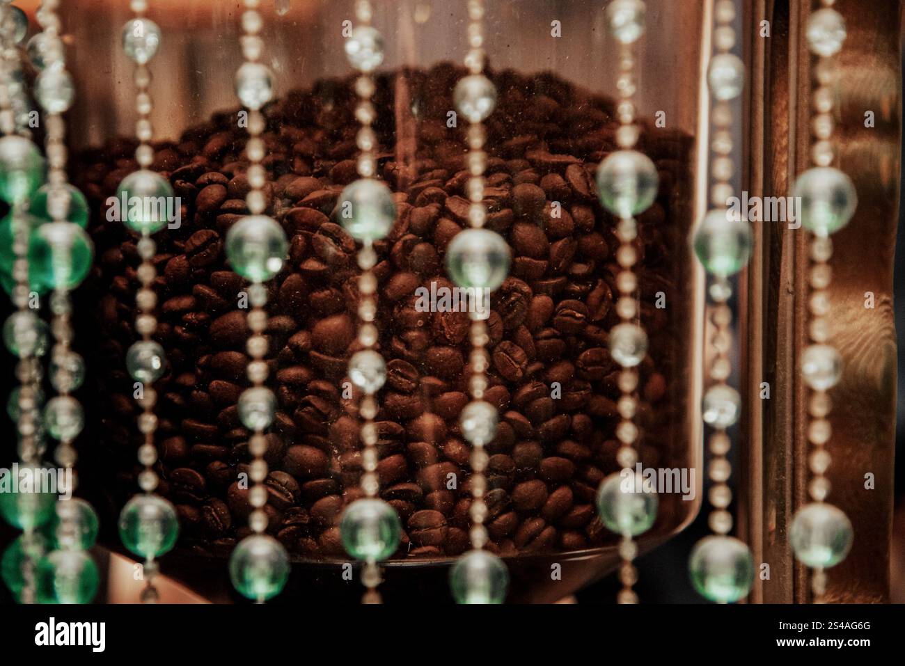 Coffee beans in a glass vase, delicious aromatic black coffee drink in ...