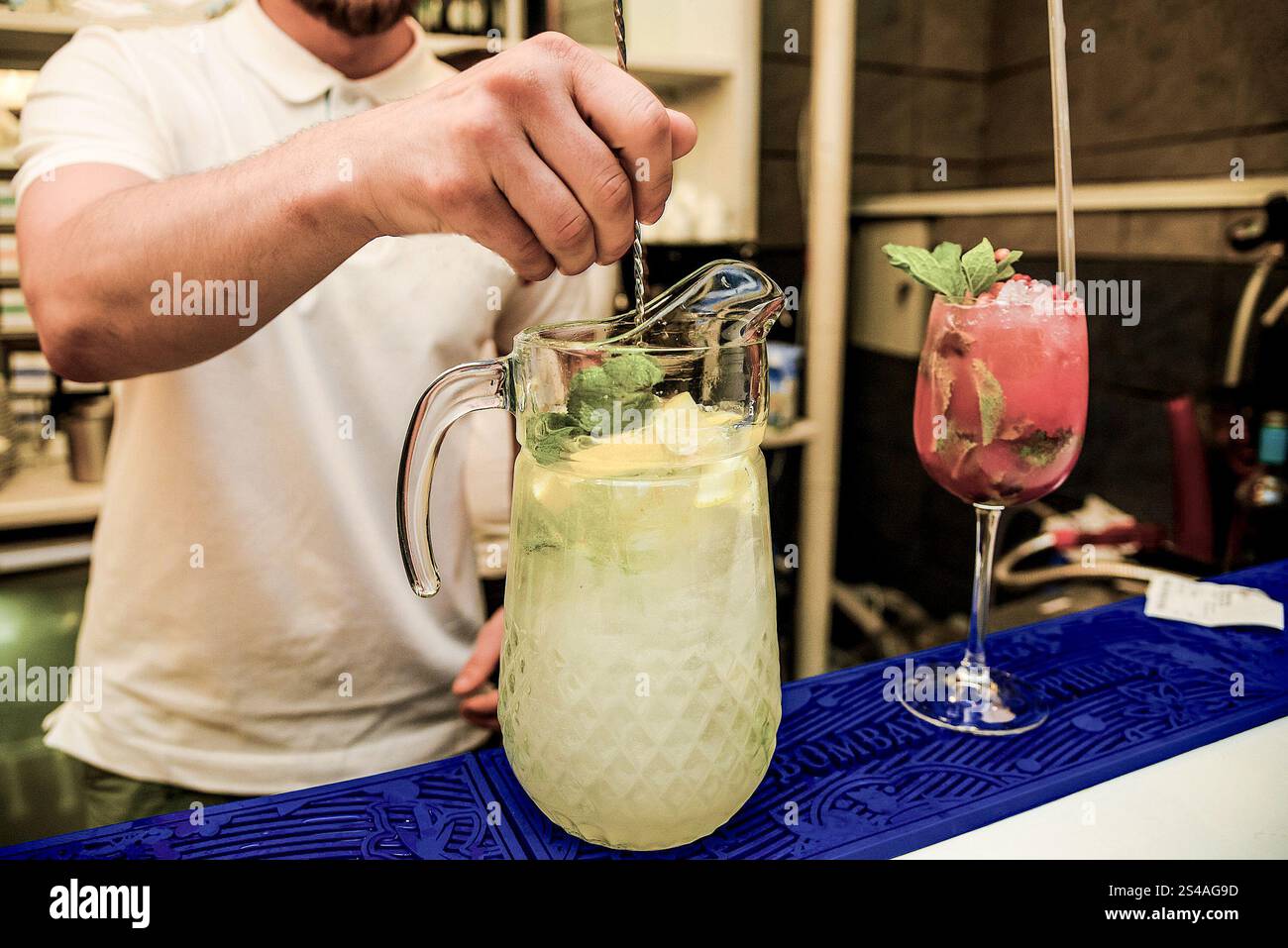 Alcoholic cocktail in a glass wineglass, nightlife in a club bar ...