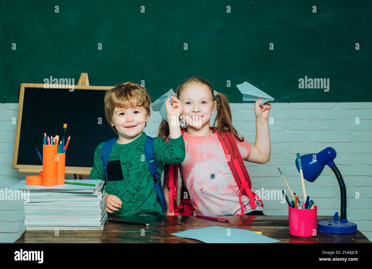 Back to school and happy time. Happy cute clever boy and cute little ...