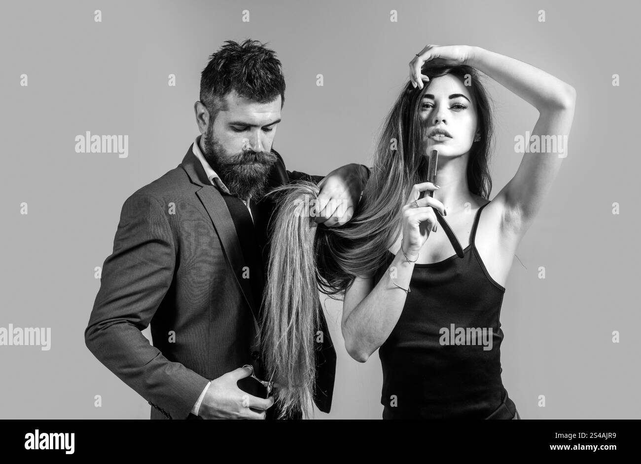 Long hair. Fashion haircut. Balm on dry body parts to turize skin ...