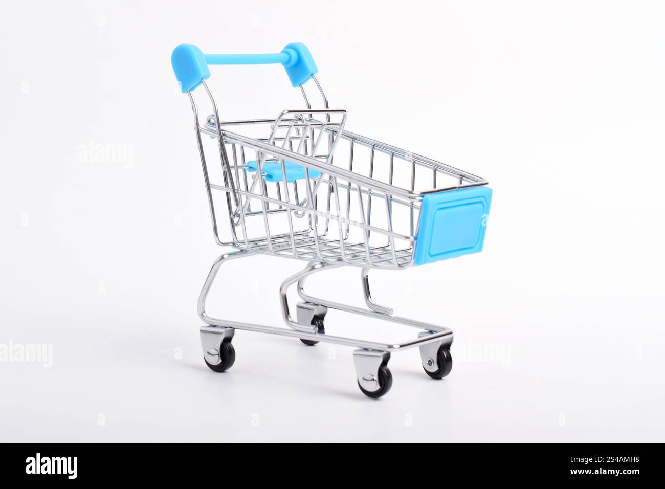 Mini model of blue shopping cart isolated on white background. Shopping ...