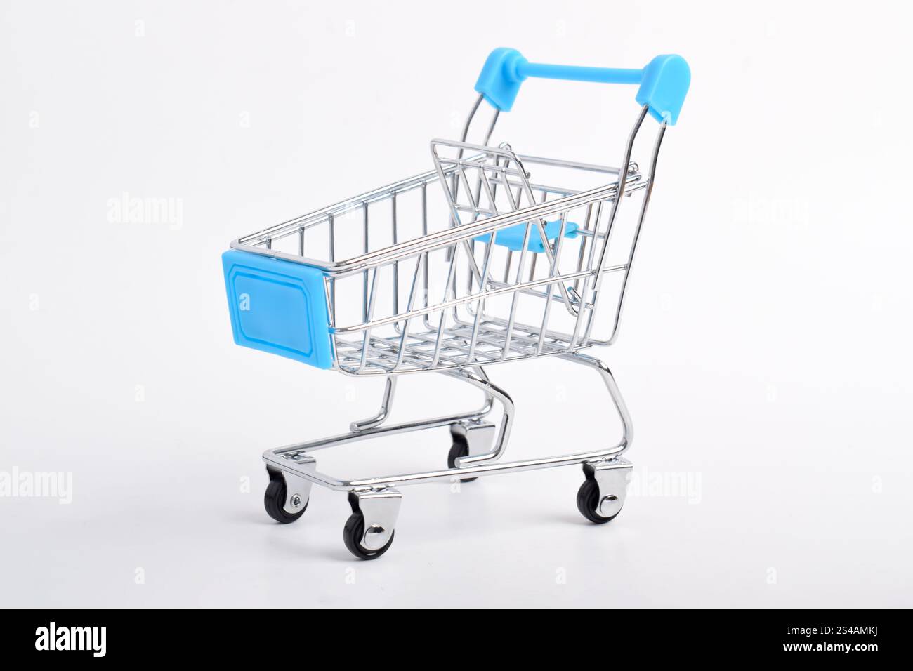 Mini model of blue shopping cart isolated on white background. Shopping ...
