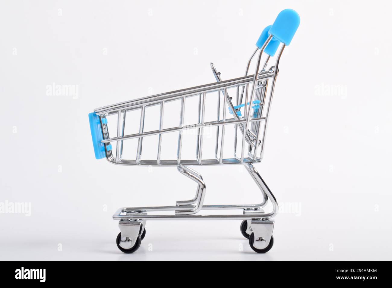 Mini model of blue shopping cart isolated on white background. Shopping ...