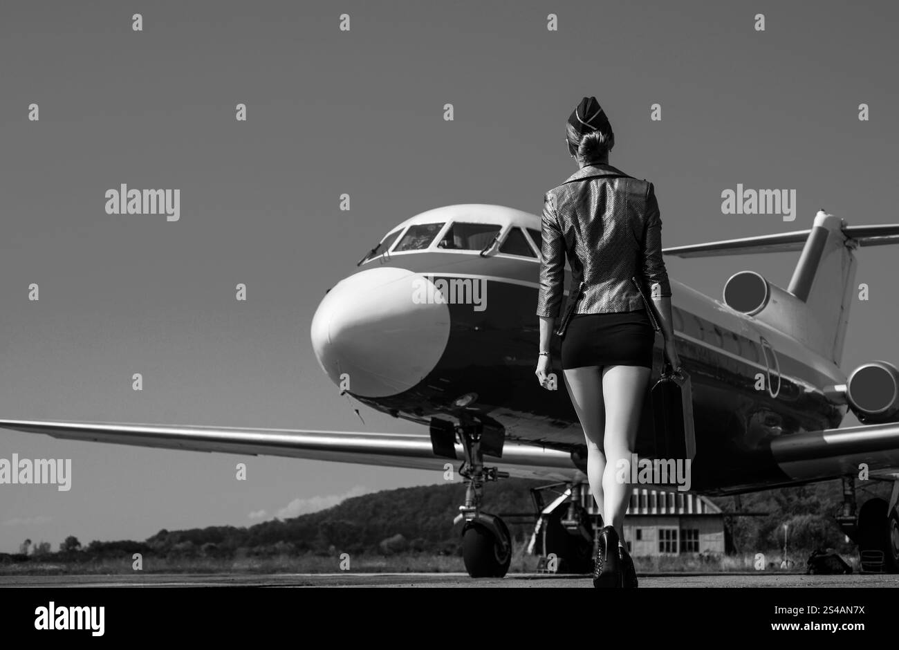 Attractive young woman flight attendant stewardess - back view ...