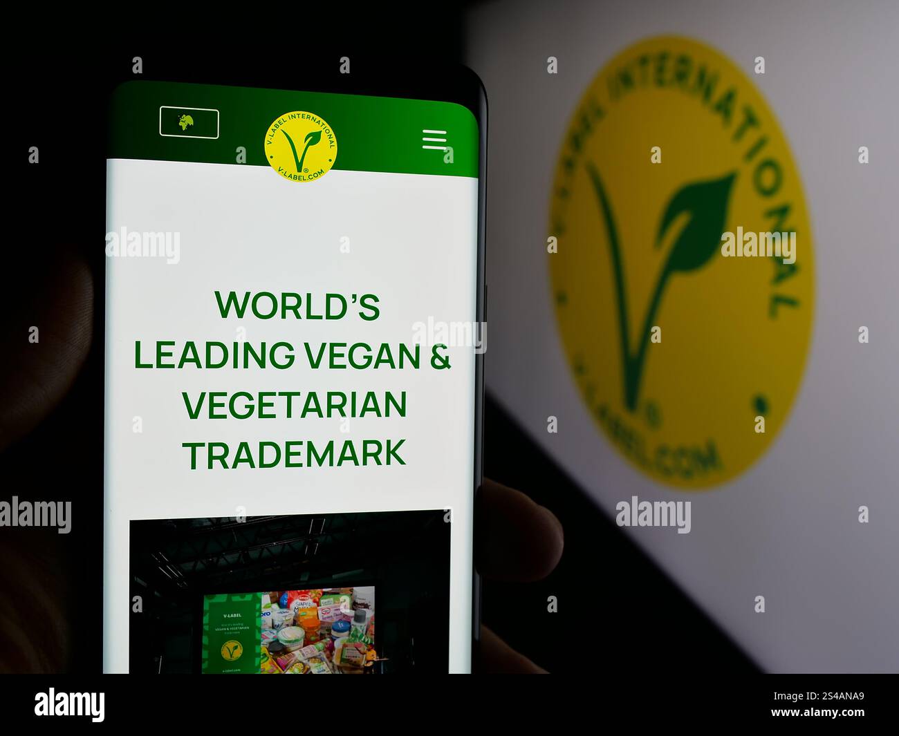 In this photo illustration, a person is holding a smartphone with the ...