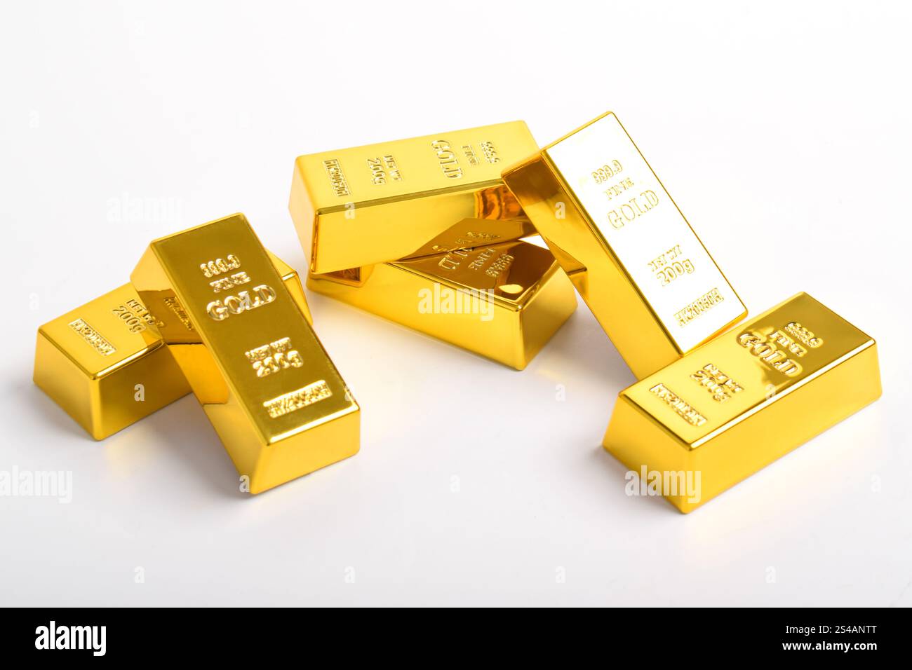 Many shiny gold bars isolated on white background Stock Photo - Alamy