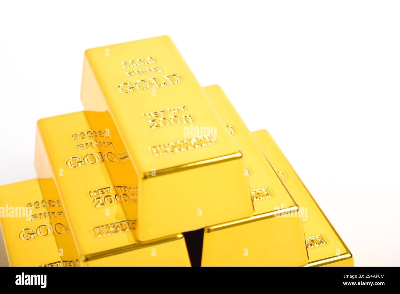 Stack of shiny gold bars isolated on white background, close up Stock Photo - Alamy