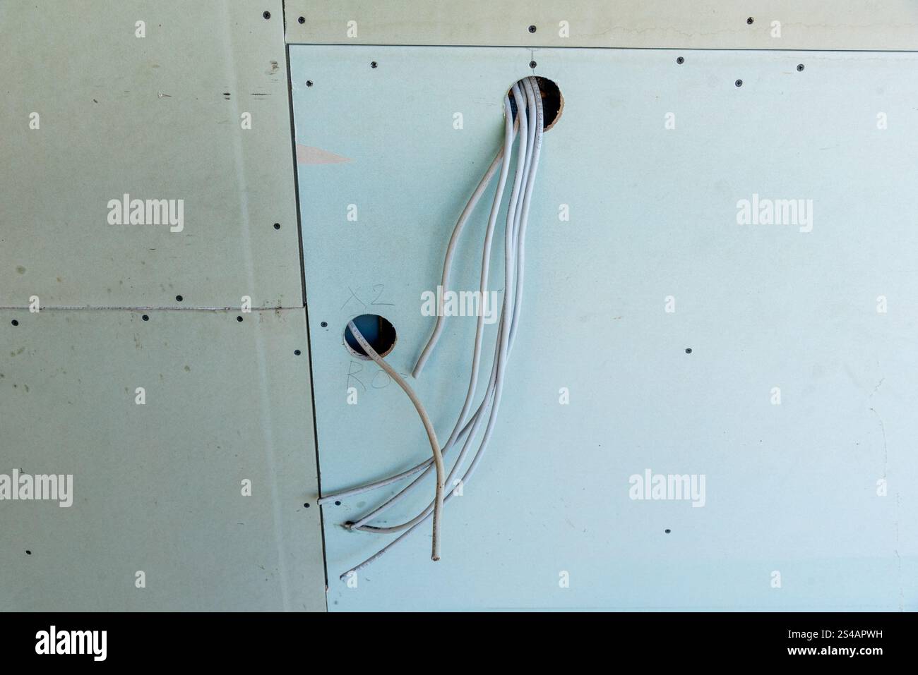 Apartment renovation, the wire sticks out of the hole for sockets in ...