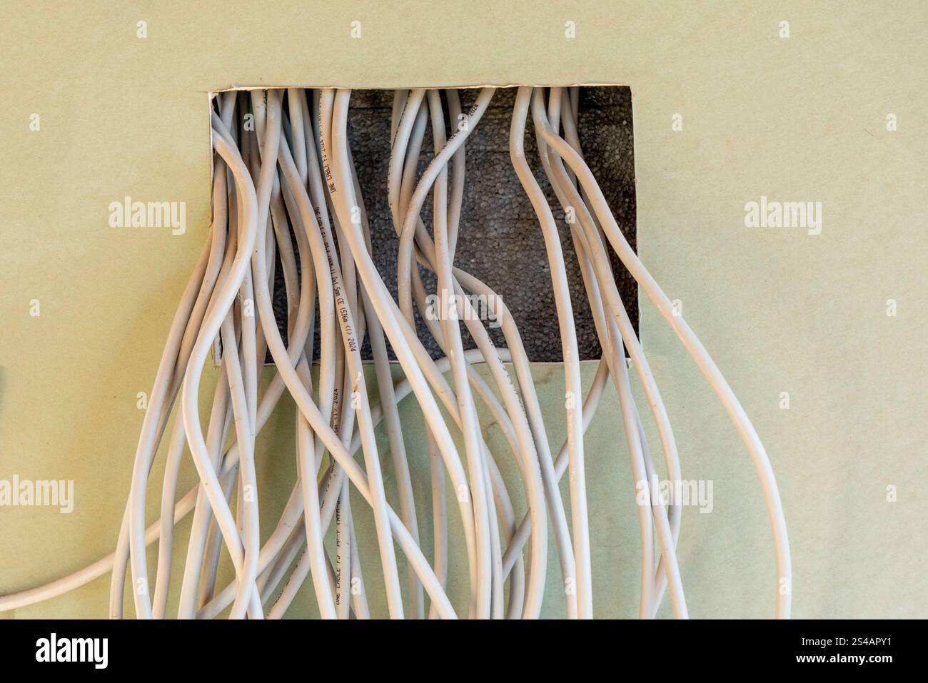 Apartment renovation, the wire sticks out of the hole for sockets in ...