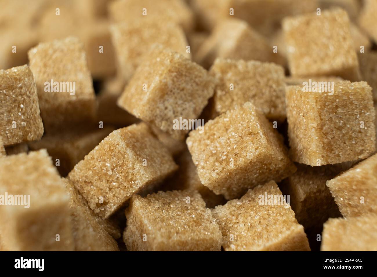 Macro cubes of brown cane unrefined dry demerara sugar Stock Photo - Alamy