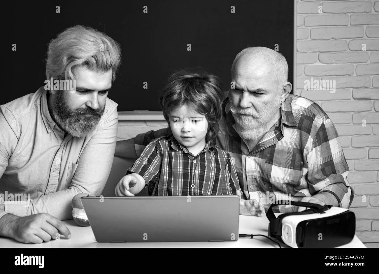 Man in different looking at laptop screen, social network. Old ...