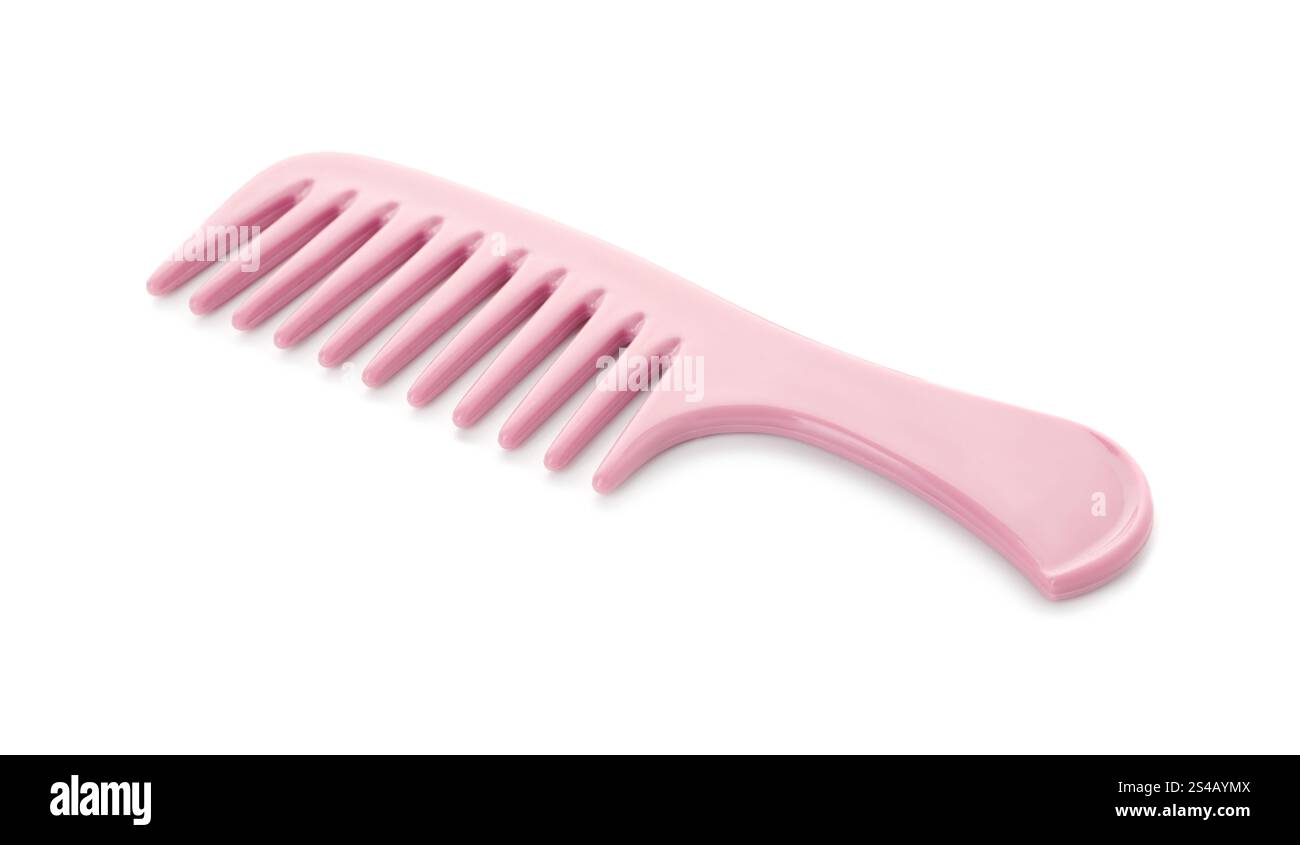 One pink plastic comb isolated on white Stock Photo - Alamy