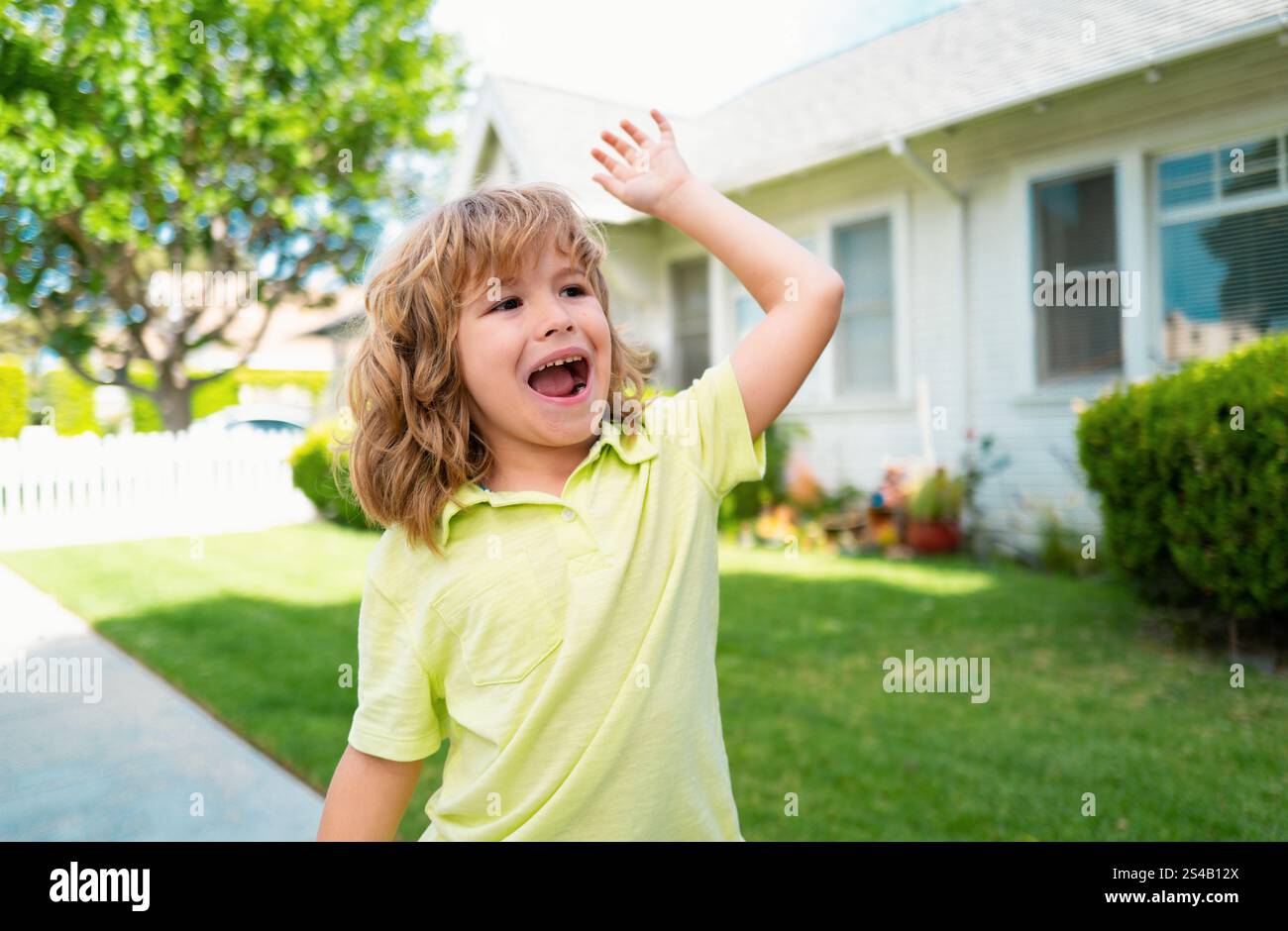 Boy with good bye or hello sign outdoor. Kids with funny face bye bye ...