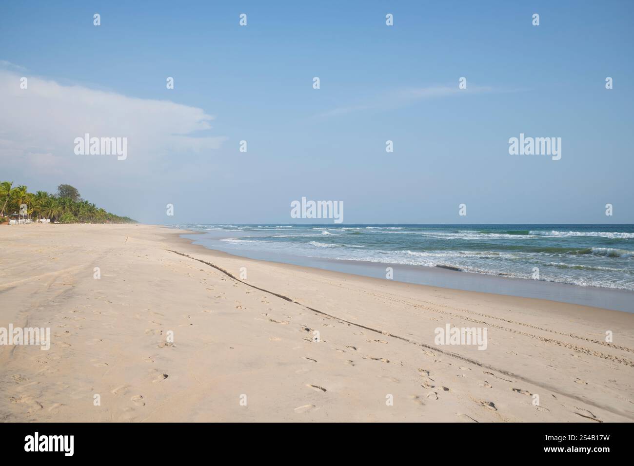 Scenic view of a beach at Assinie, Assinie-Mafia, showcasing golden sands and gentle waves under ...