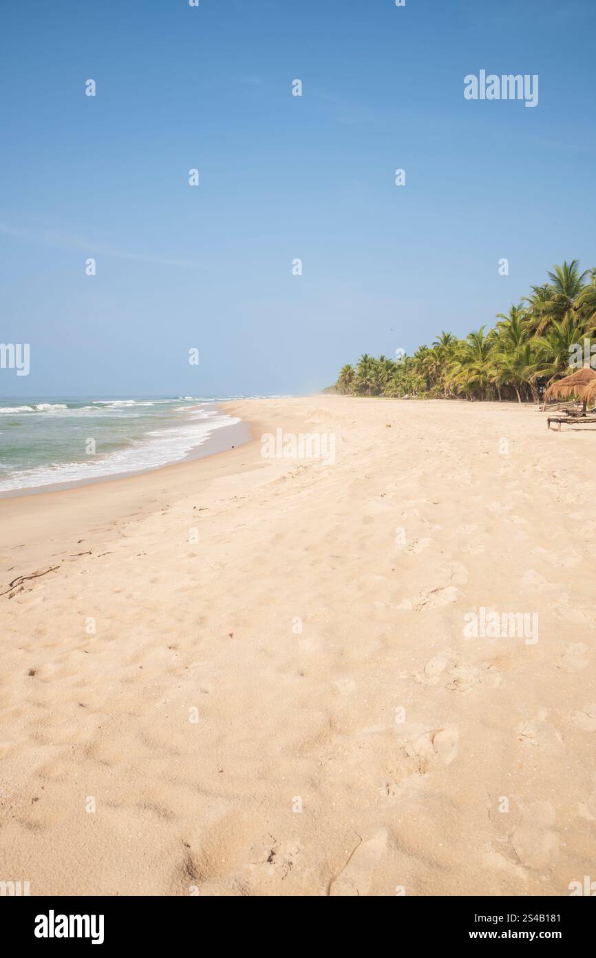 Vertical view of a beach at Assinie, Assinie-Mafia, showcasing golden ...