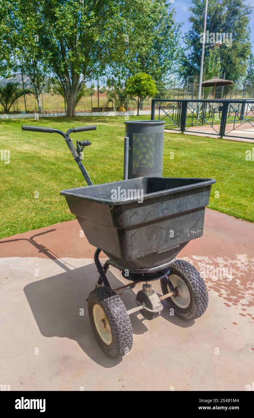 Wheelbarrow fertilizer spreader for garden. Manual tools for lawn ...