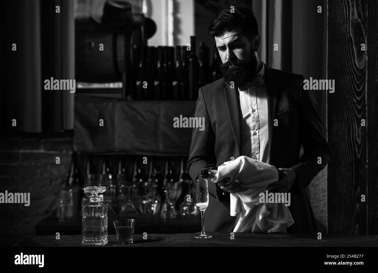 Champagne pouring in classic glass Black and White Stock Photos ...