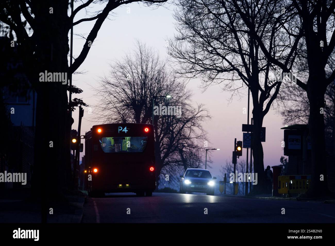On the coldest night of the year so far, a P4 London bus drives towards ...