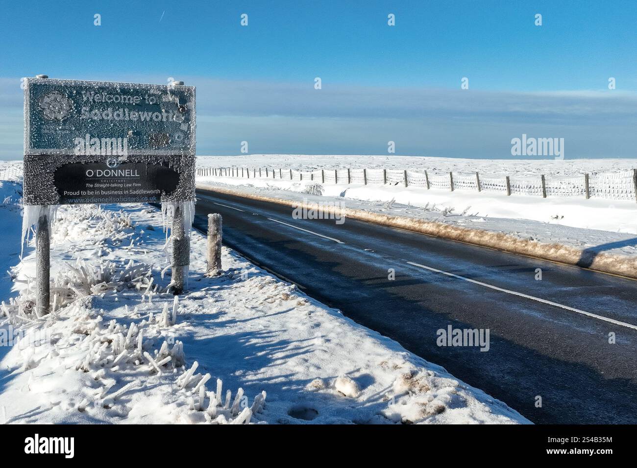 Heavy snow on Saddleworth Moor and a clear A635 after days of sub-zero ...