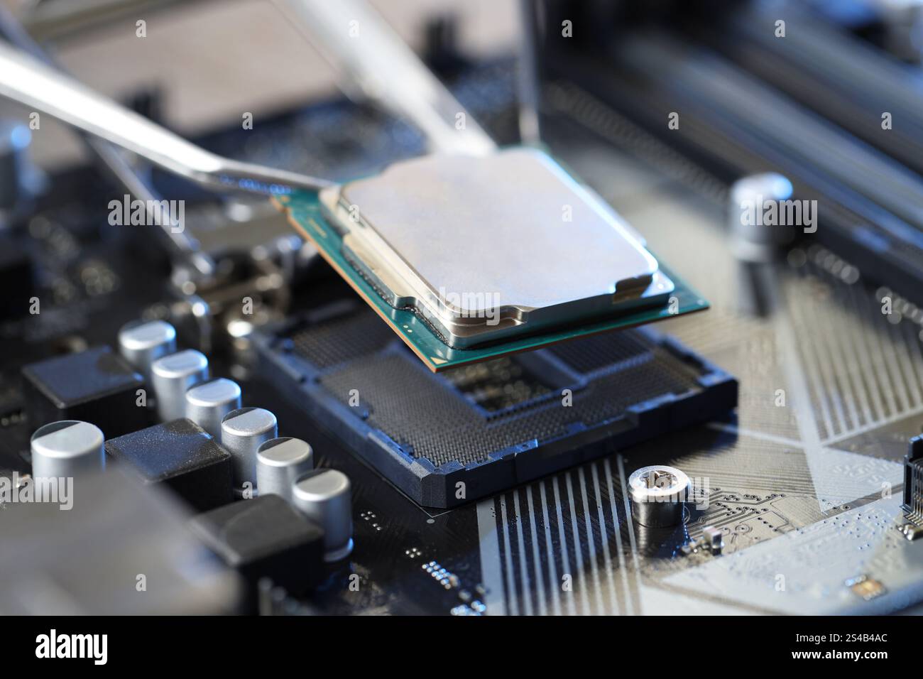Installing modern computer chip onto motherboard, closeup Stock Photo ...