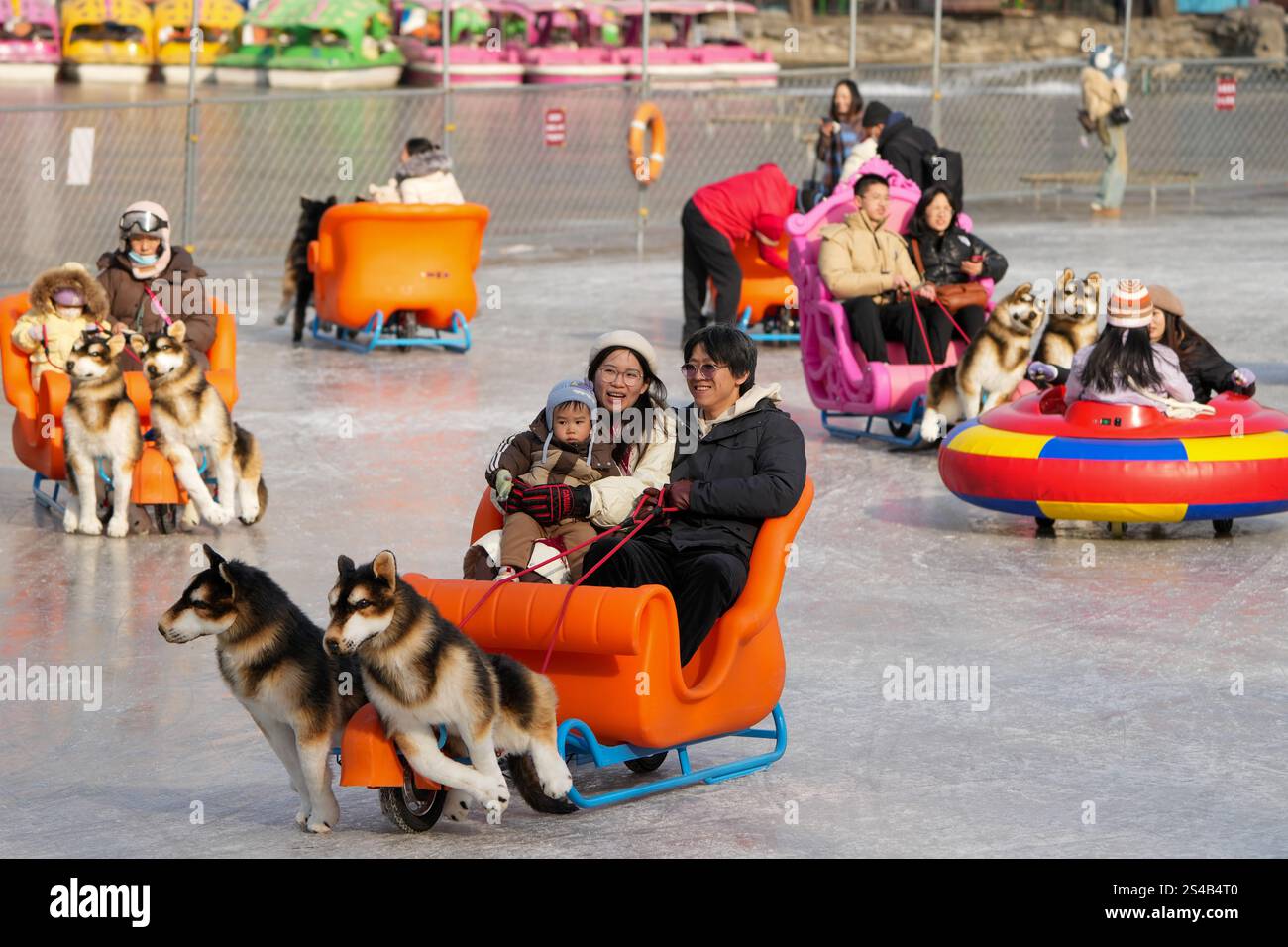 Beijing, China. 11th Jan, 2025. People enjoy themselves on the ice rink ...
