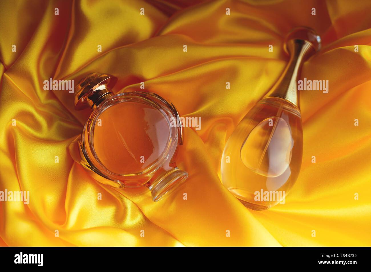 Luxury Perfume bottle on silky cloth Stock Photo - Alamy