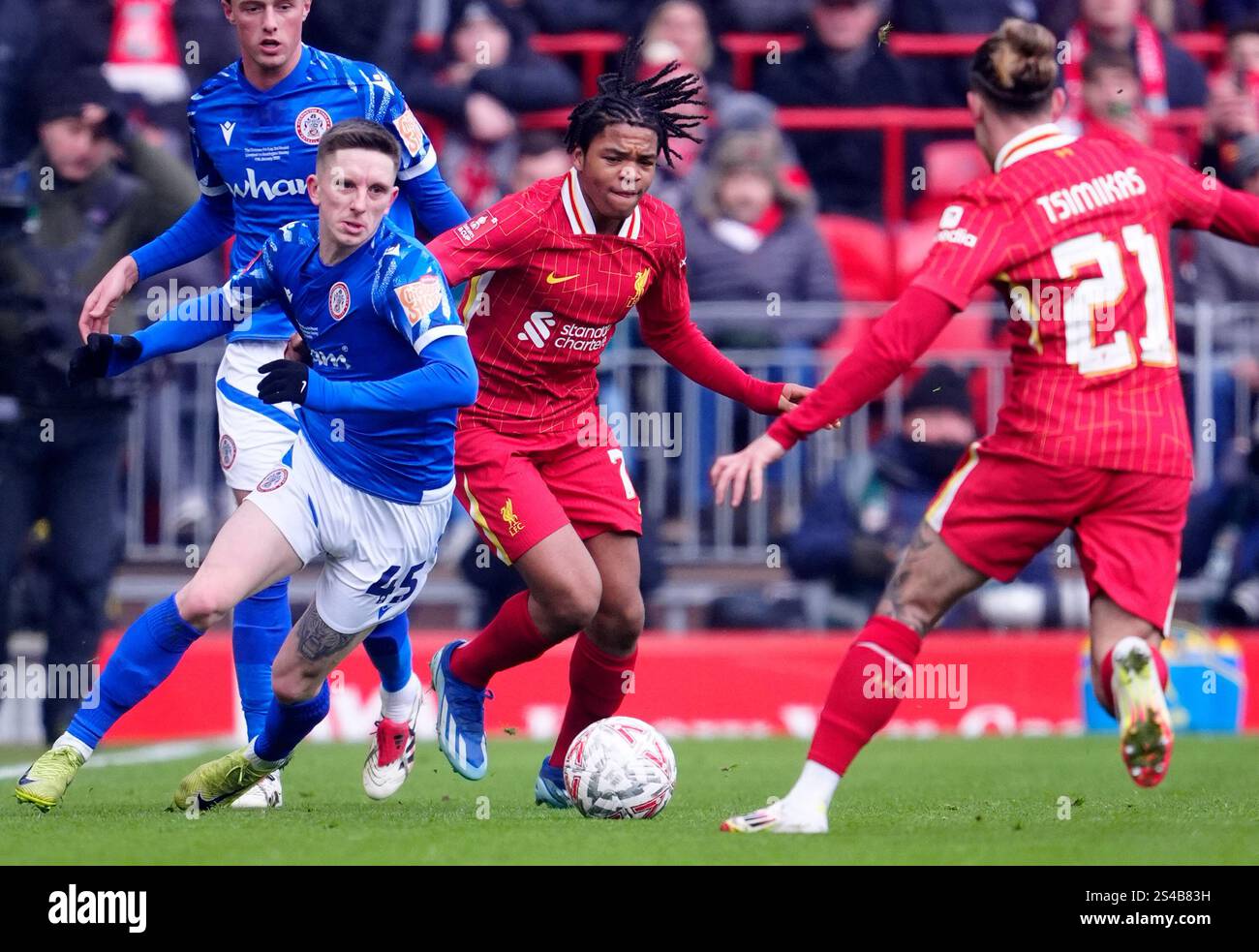 Liverpool's Rio Ngumoha (centre) and Accrington Stanley's Ash Hunter ...