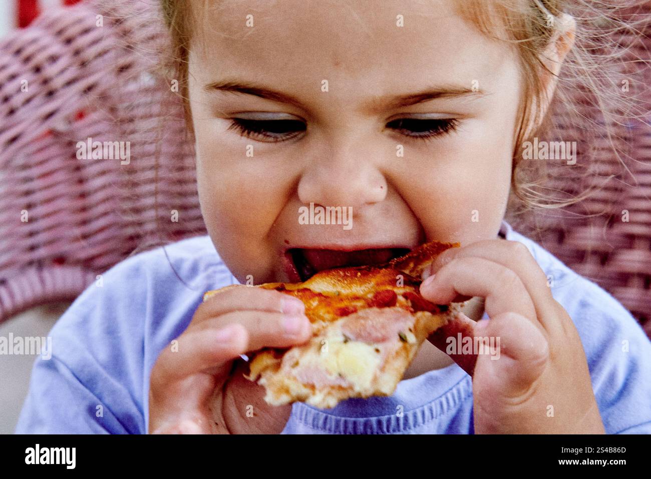 Little Girl Toddler Eating Biting piece Pizza With Cheese Close Up ...