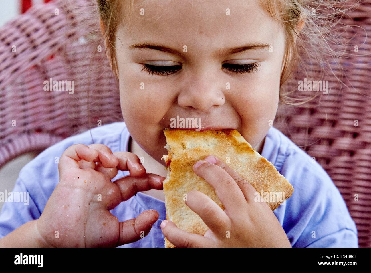Little Girl Toddler Eating Biting piece Pizza With Cheese Close Up ...