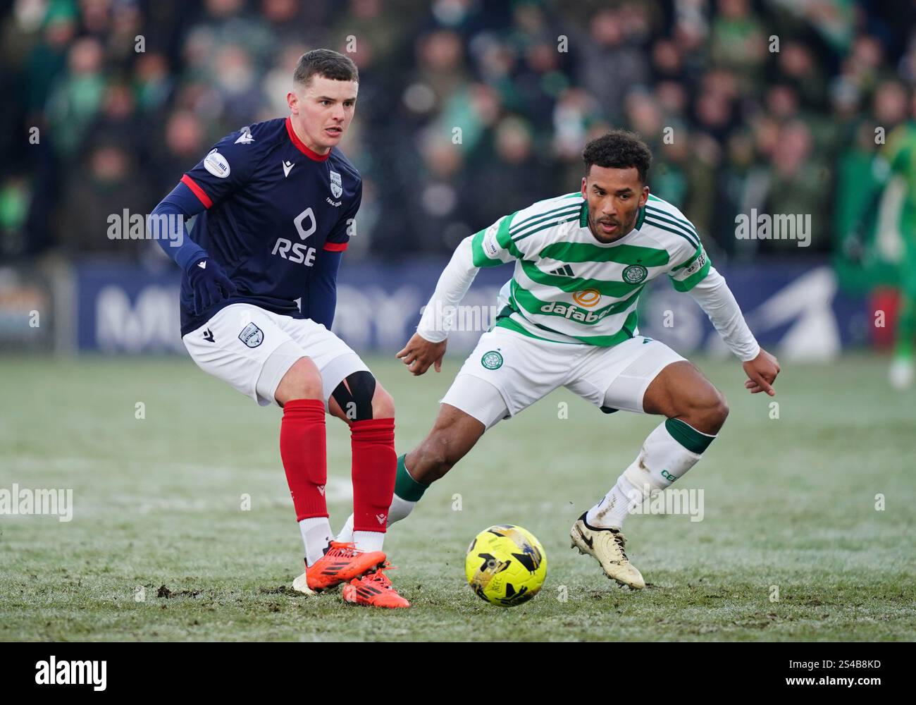 Ross County's Ronan Hale (left) and Celtic's Auston Trusty in action ...