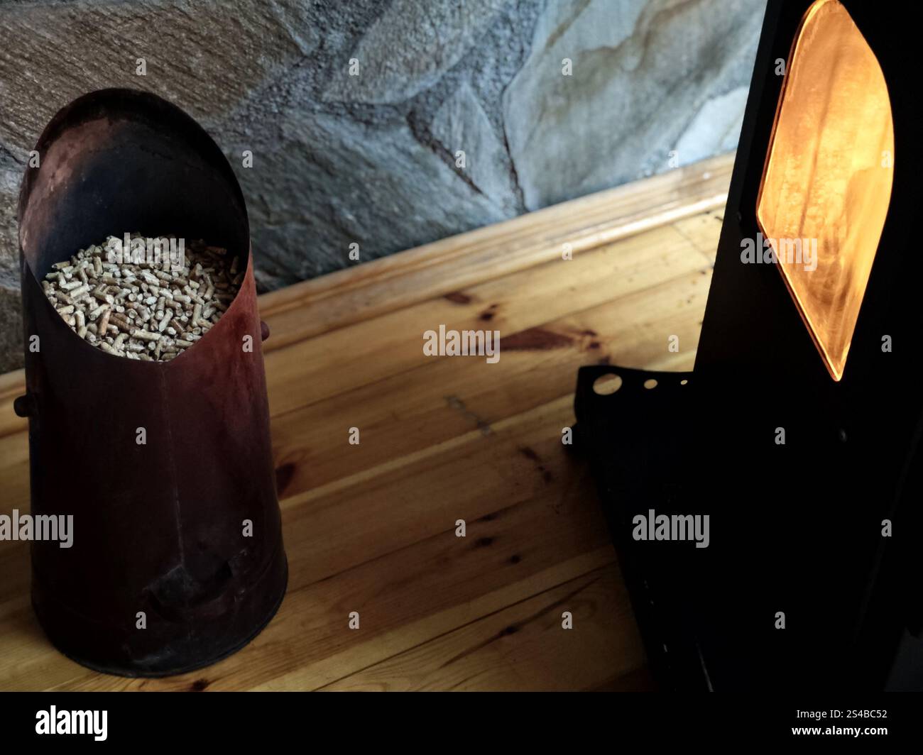 The wood pellets in the pellet hopper are beside the modern fireplace ...