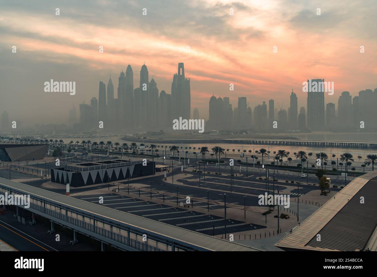 The sun sets over the iconic skyline of Dubai, shrouded in a mystical ...