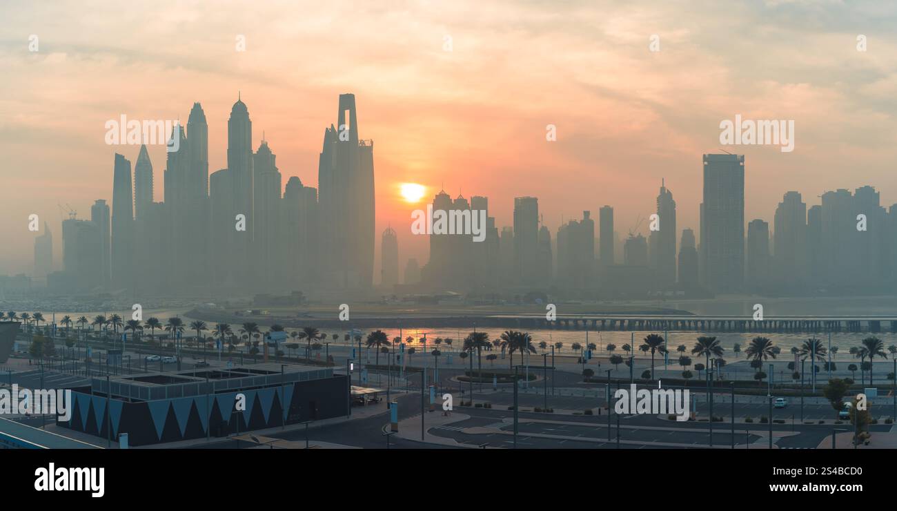 A stunning view of Dubai as the sun sets, casting a mystical glow ...