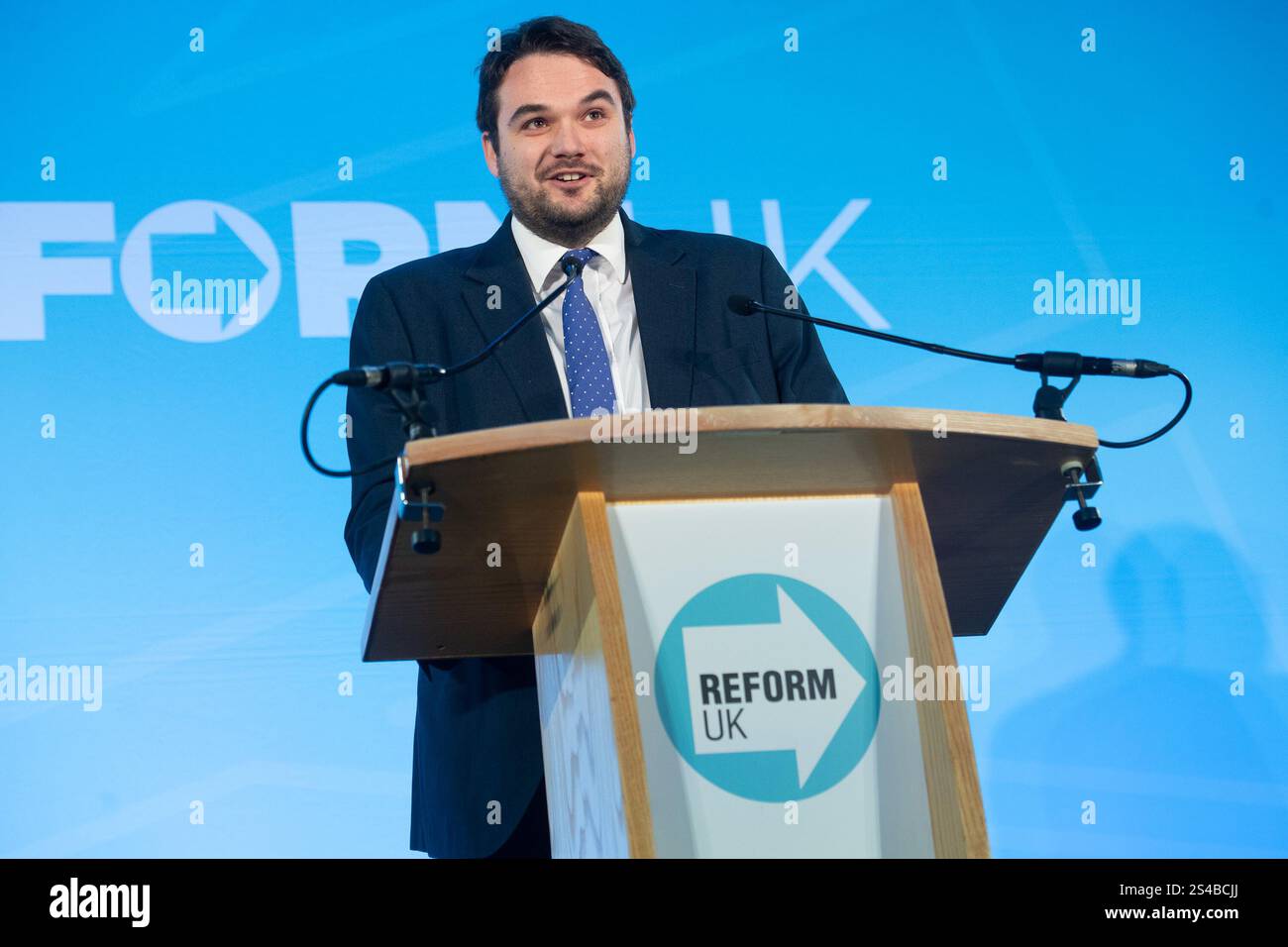 Esher, UK. 10 Jan 2025. Reform UK Councillor Robin Hunter-Clarke speaks ...