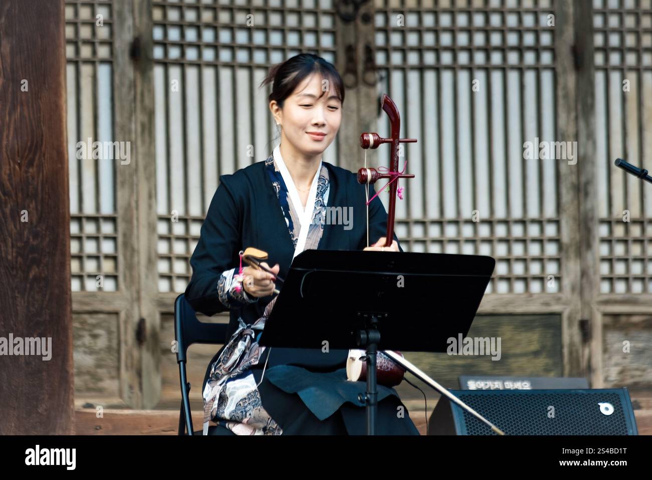 Korean woman violoncellist on the stage during the concert in Seoul ...