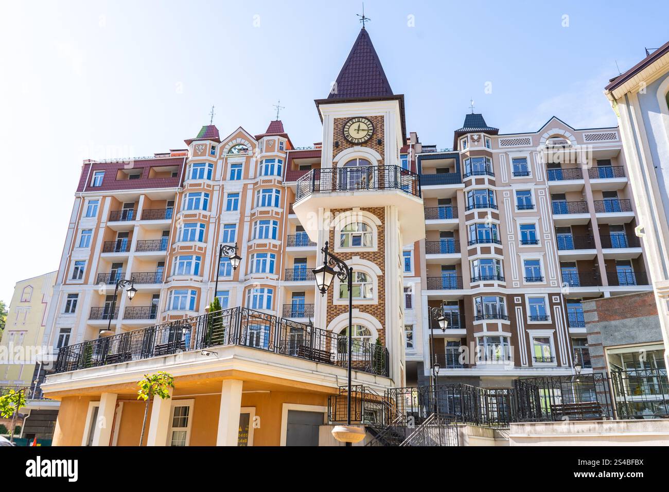 Multicolor modern exterior of Houses Buildings with clock time tower ...