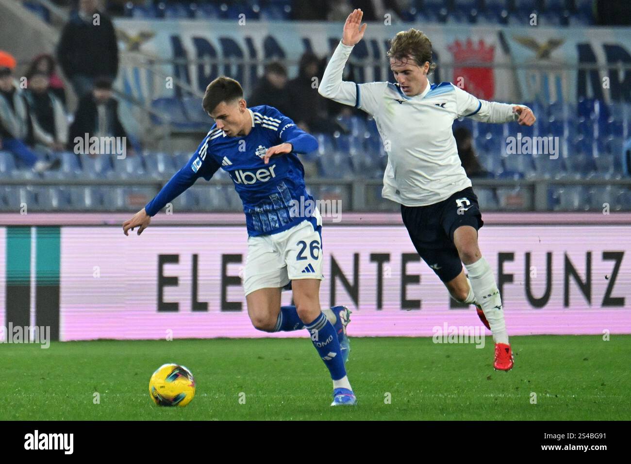 Rome, Italy. 10th Jan, 2025. Yannik Engelhardt of Como (L) and Nicolo Rovella of SS Lazio (R ...