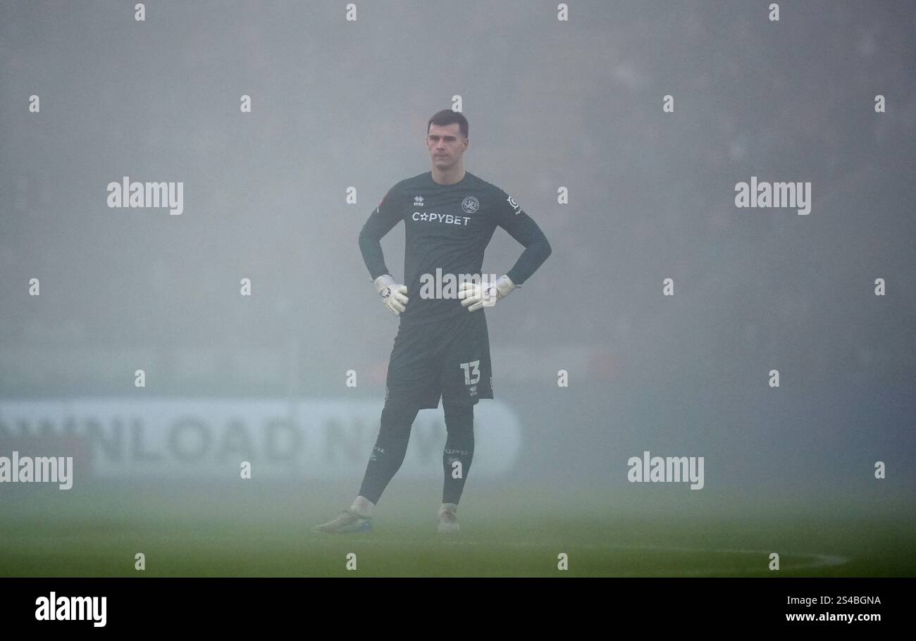 Heavy fog descends as Queens Park Rangers goalkeeper Joe Walsh looks on ...