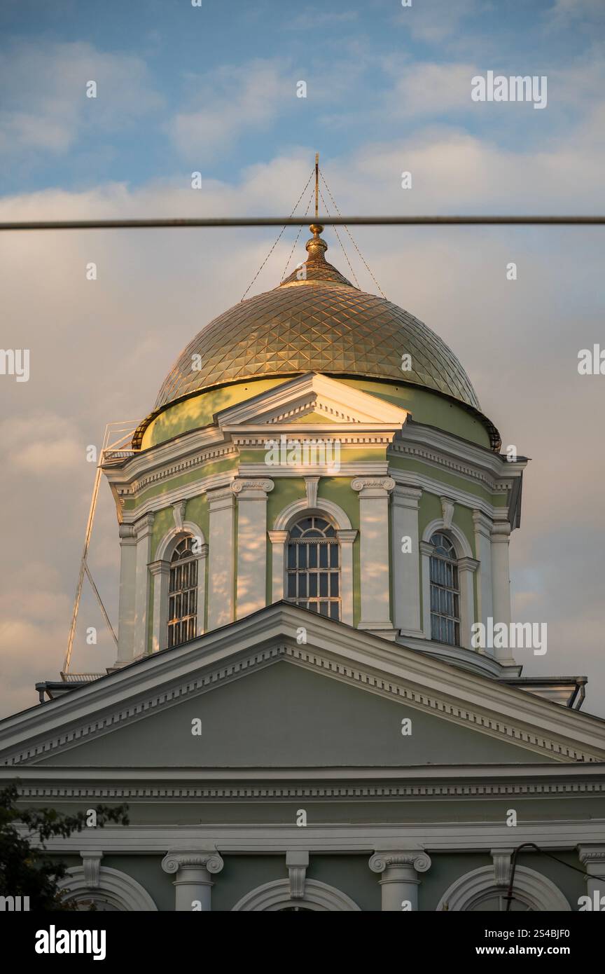 A clock tower in front of a building Stock Photo - Alamy