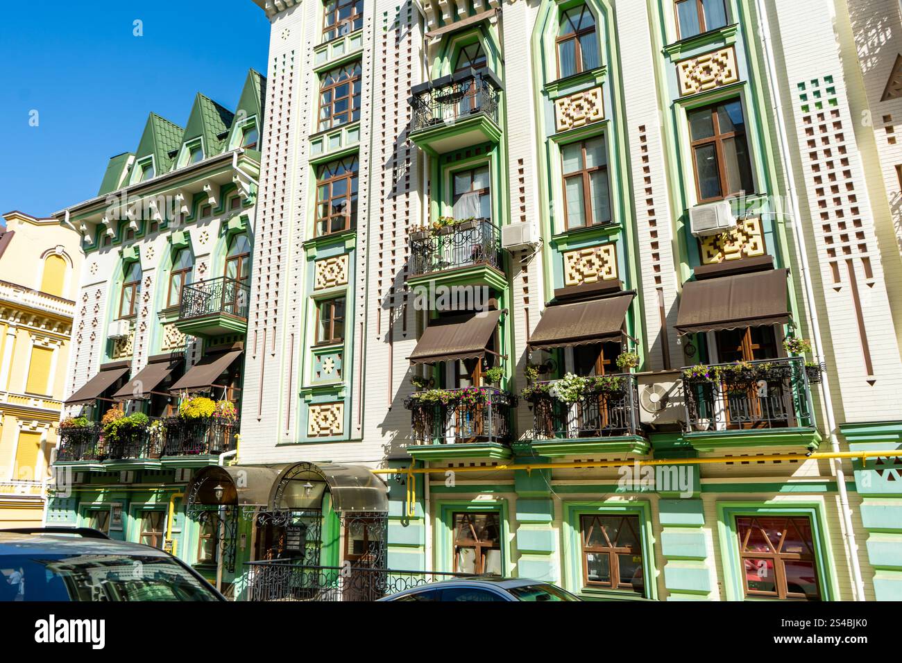 Street buildings. Open balcony with forged bars and railings. Terrace ...