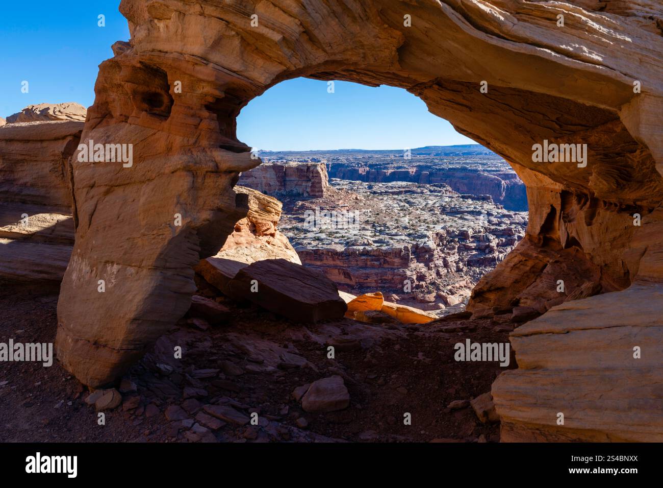 Morning view through a rock window overlooking Labyrinth Canyon, near ...