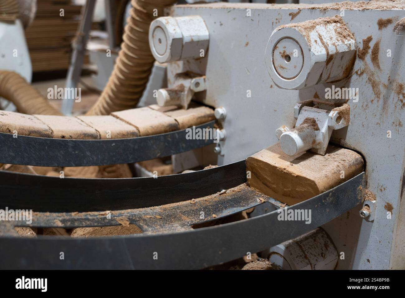 The wood processing plant operates machines that process and shape wood ...