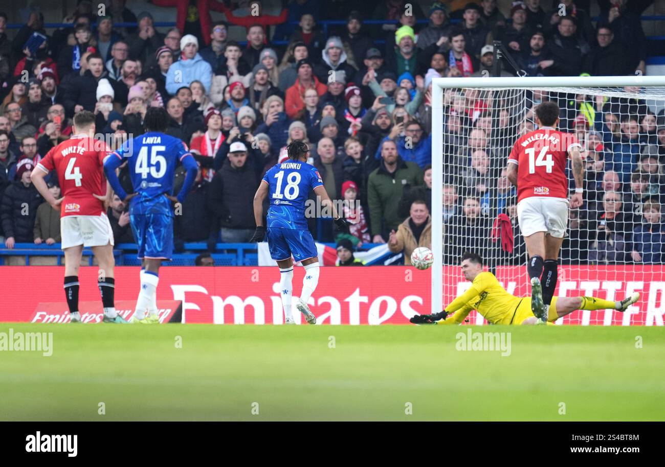 Morecambe's Harry Burgoyne saves the penalty of Chelsea's Christopher ...