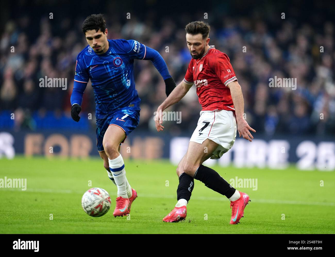 Chelsea's Pedro Neto (left) and Morecambe's Gwion Edwards battle for ...