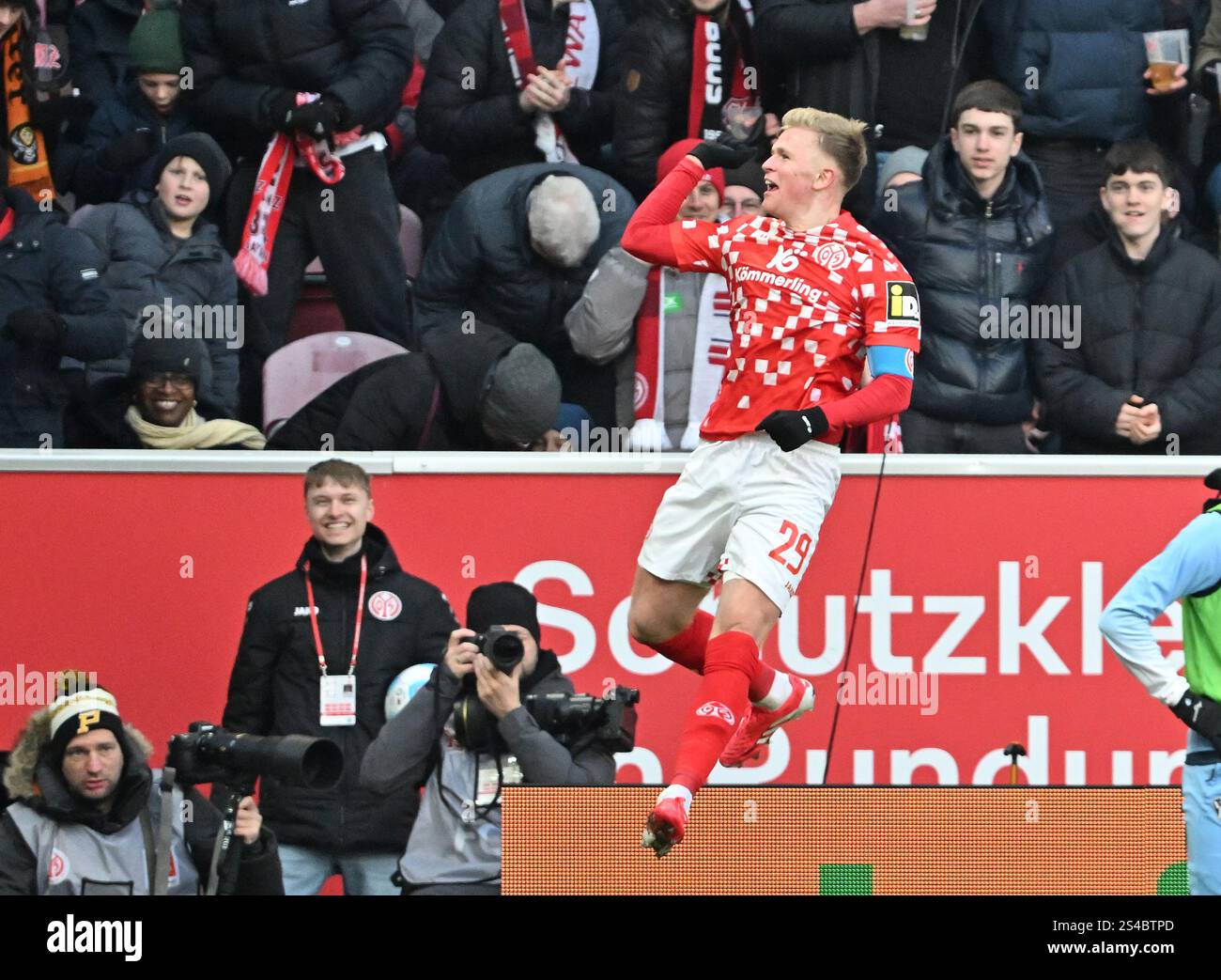Mainz's Jonathan Burkhardt celebrates after scoring, during the German ...