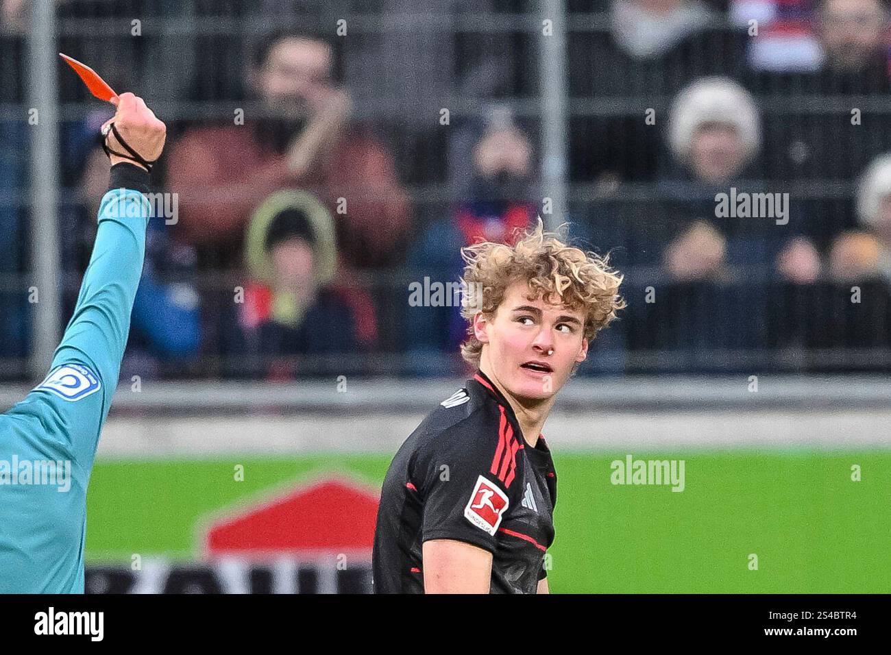 Referee Robert Hartmann shows Berlin's Tom Rothe the red card during ...